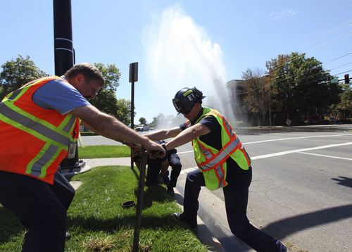 Water main breaks, closes downtown SLC intersection - The Salt Lake Tribune