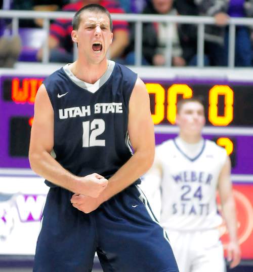 College basketball: Utah State defeats Weber State 73-70 after enduring ...
