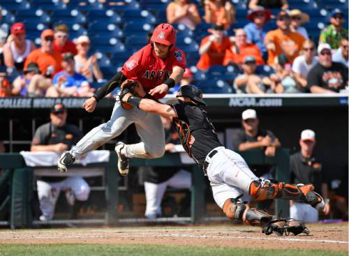 College world series: Arizona tops Cowboys 9-3, forces CWS bracket ...