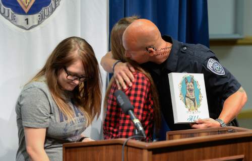 Family of man who died in Utah police shootout gifts portrait of K-9 ...