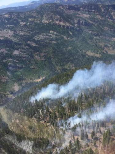 Crews closing Utah fire lines, even as they warily watch the skies ...