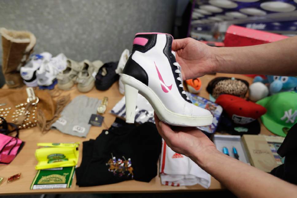 Fake fashion fuels vast illicit profits, misery - The Salt Lake Tribune