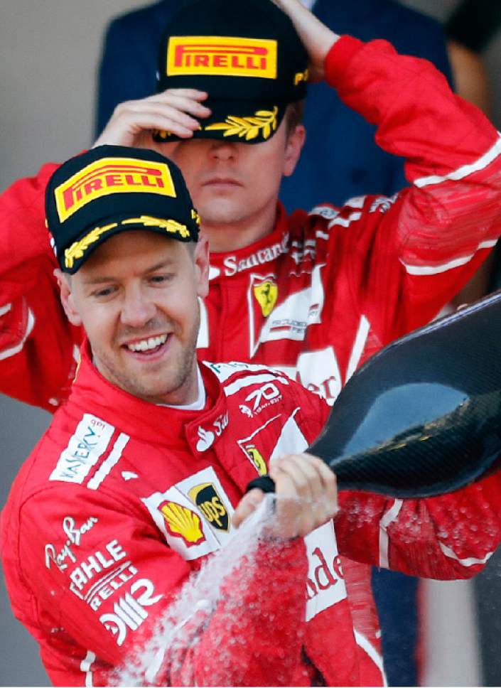 Auto racing: Vettel happy again after extending lead with Monaco GP win ...